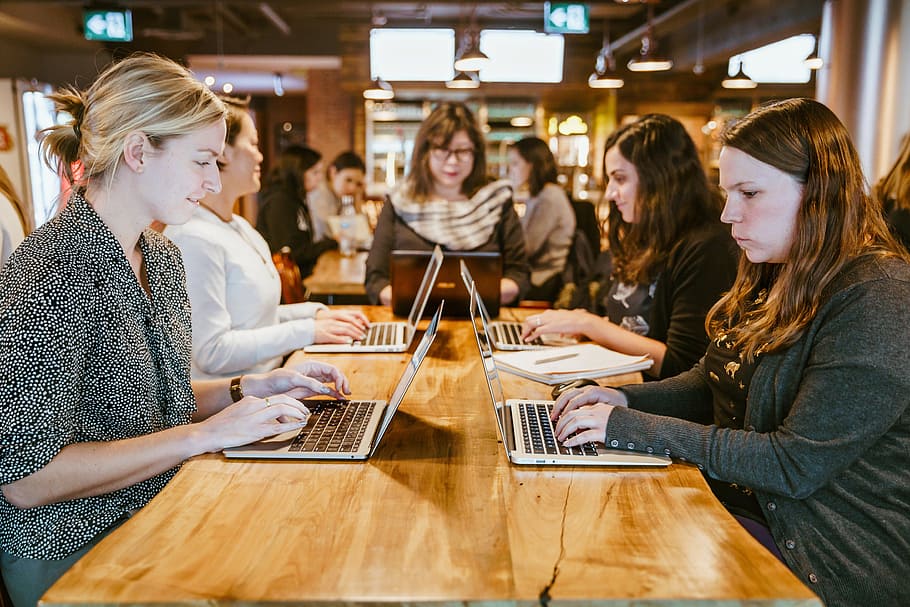 Women On Laptops Around Table Photo, School, Coding, - Table - 910x607 ...